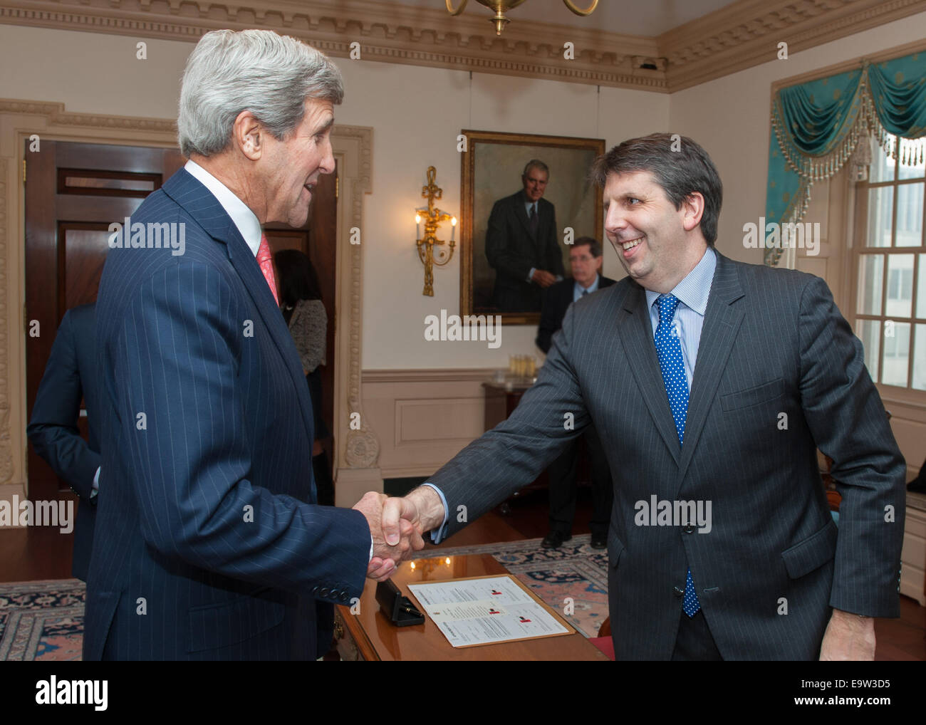 U.S. Secretary of State John Kerry greets Mark Lippert before swearing ...