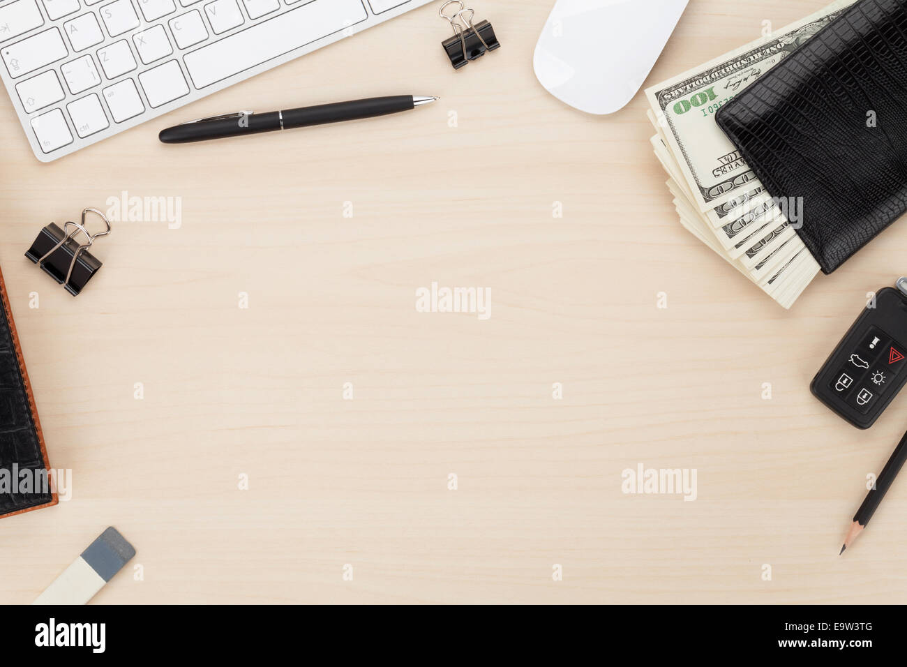 Office table with pc, supplies and money cash. View from above with ...