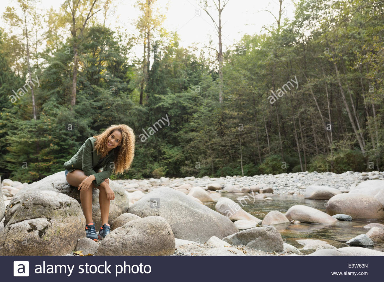 Woman on rock hi-res stock photography and images - Alamy