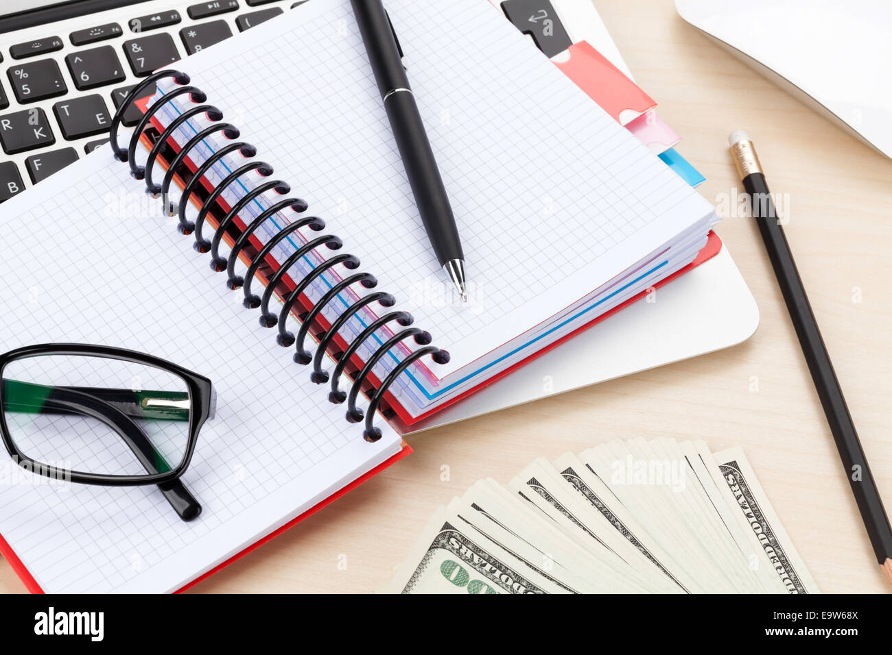 Office table with pc, supplies and money cash Stock Photo - Alamy