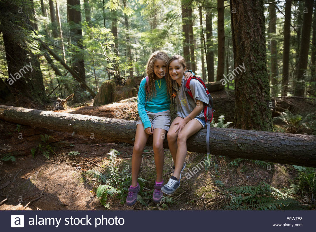 Girl looking around tree hi-res stock photography and images - Alamy