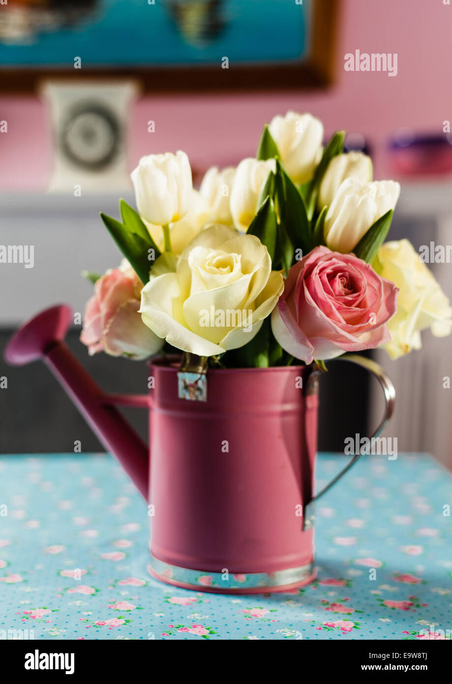 Pink Cream Roses White Tulips pink watering can on a pink and blue ...