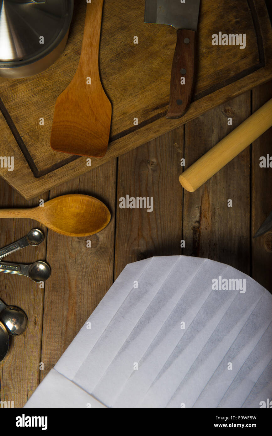 chef hat with kitchen settings and rustic look Stock Photo - Alamy