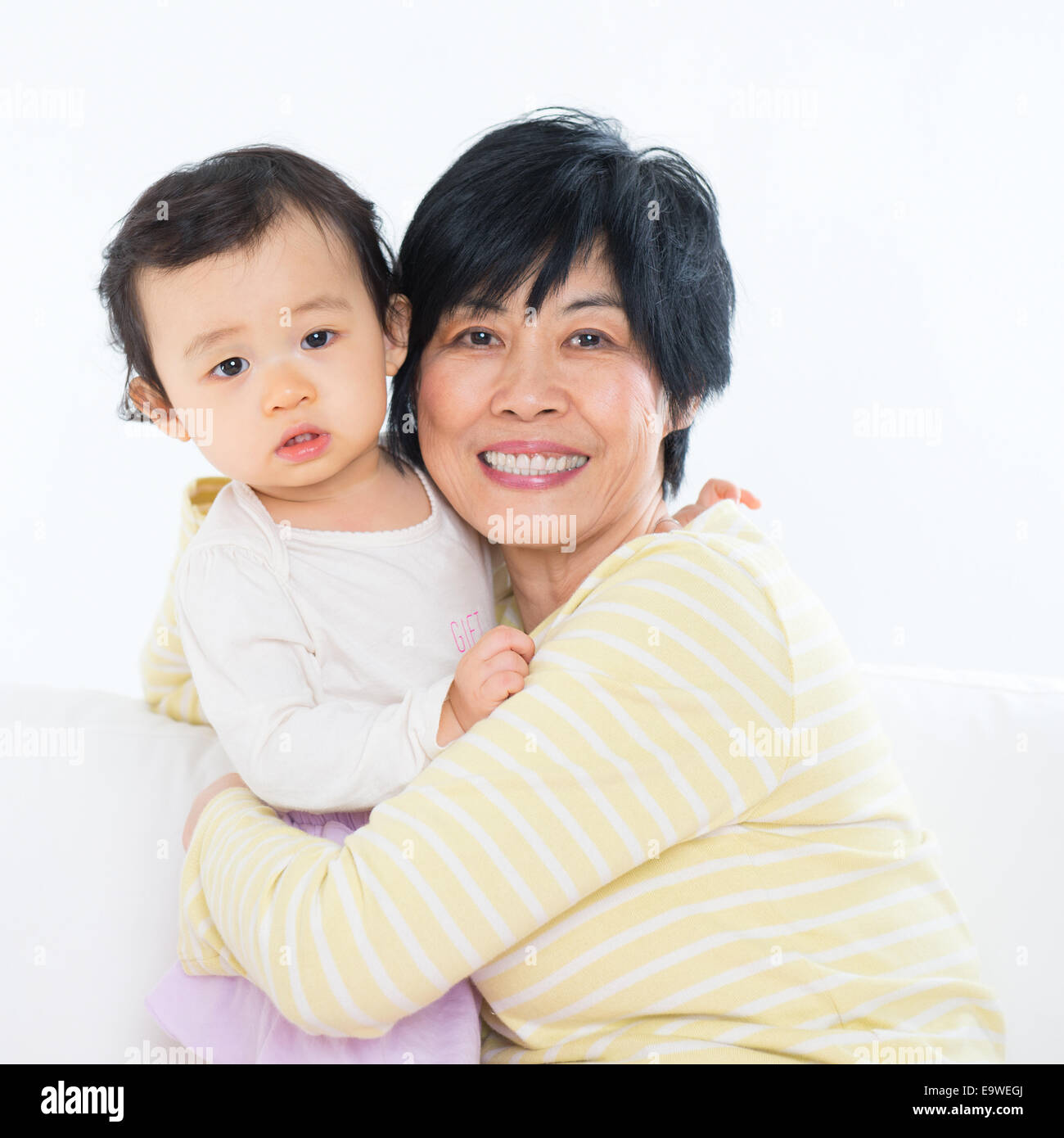 Asian family portrait, grandma and grandchild indoor living lifestyle ...