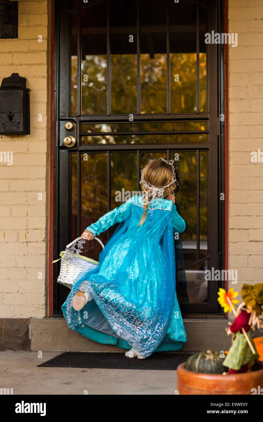 Trick or treating in costumes on Halloween night Stock Photo - Alamy