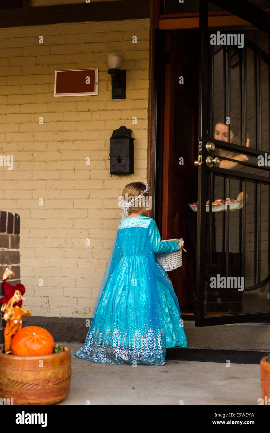 Trick or treating in costumes on Halloween night Stock Photo - Alamy