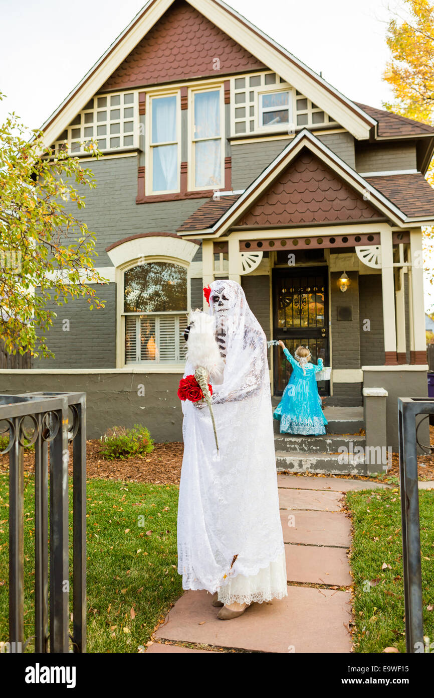 Trick or treating in costumes on Halloween night Stock Photo - Alamy