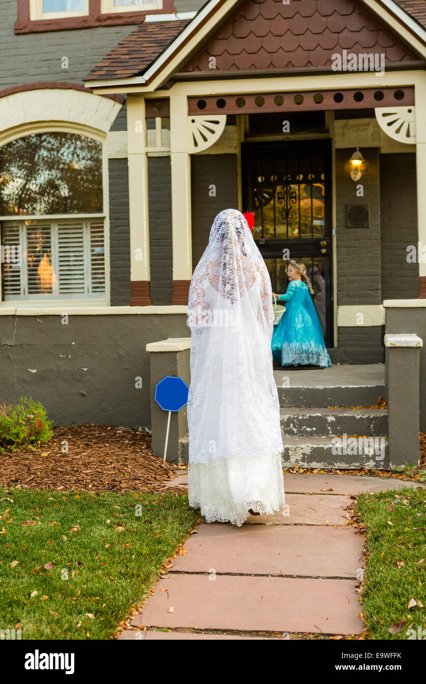 Trick or treating in costumes on Halloween night Stock Photo - Alamy