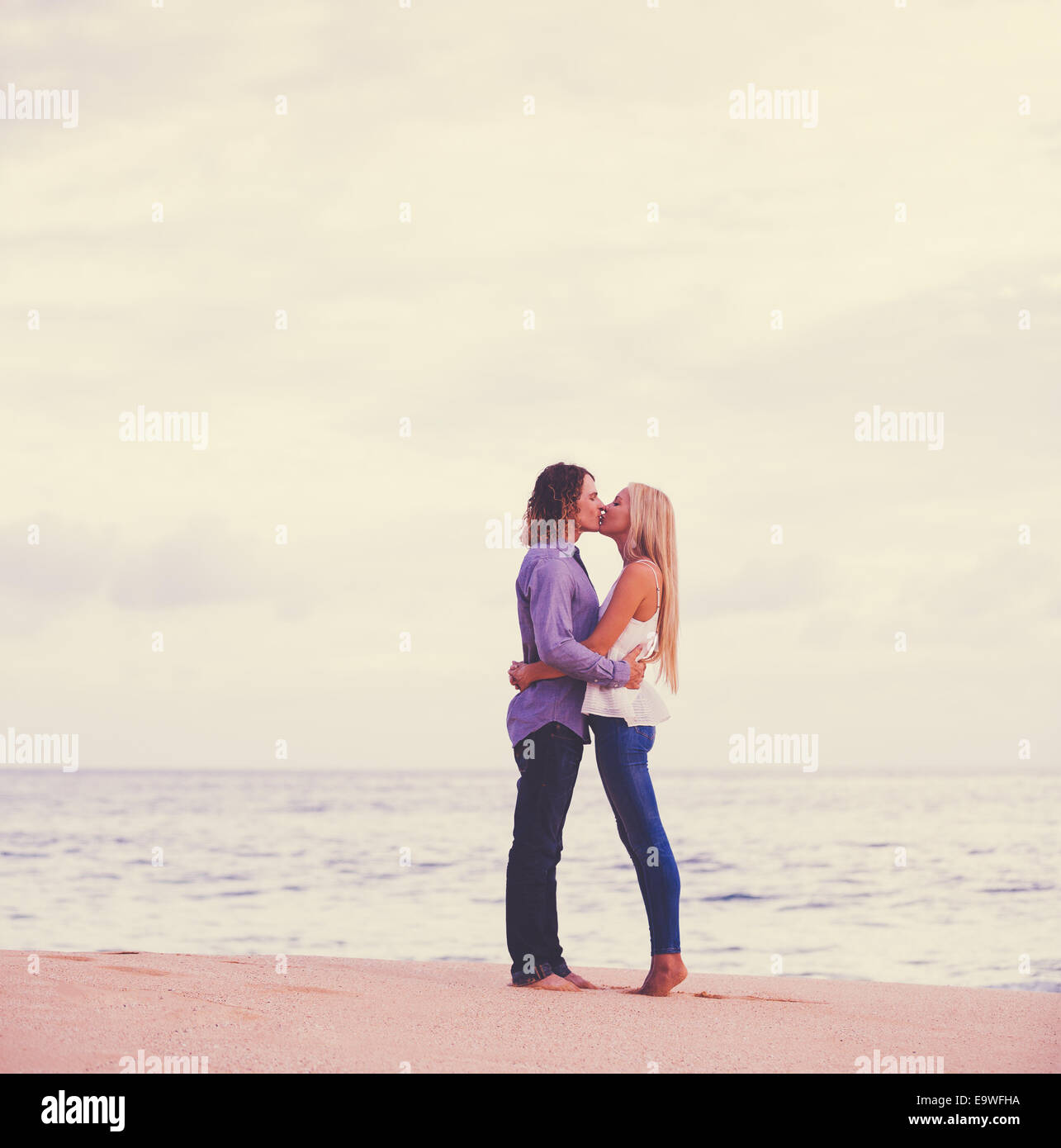 Beautiful woman man kissing beach hi-res stock photography and images ...