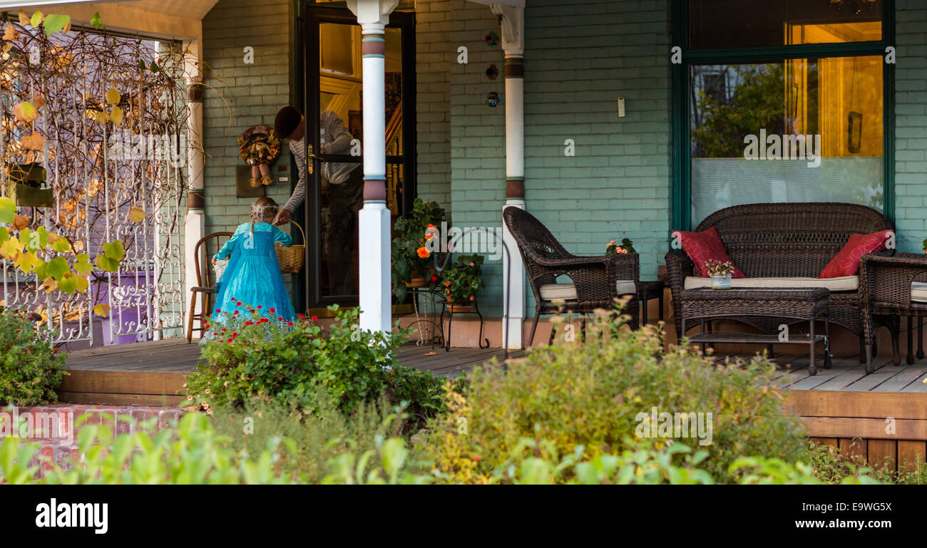 Trick or treating in costumes on Halloween night Stock Photo - Alamy