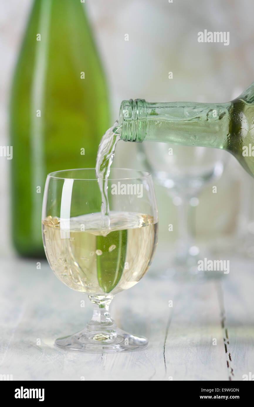 White wine is poured into a glass Stock Photo - Alamy