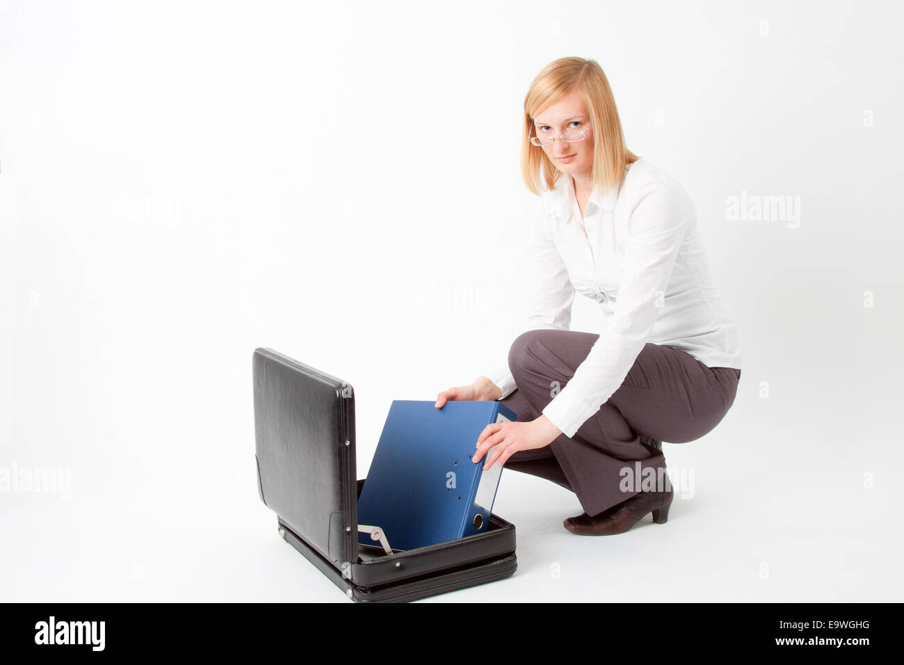 Young woman with briefcase and folders Stock Photo - Alamy
