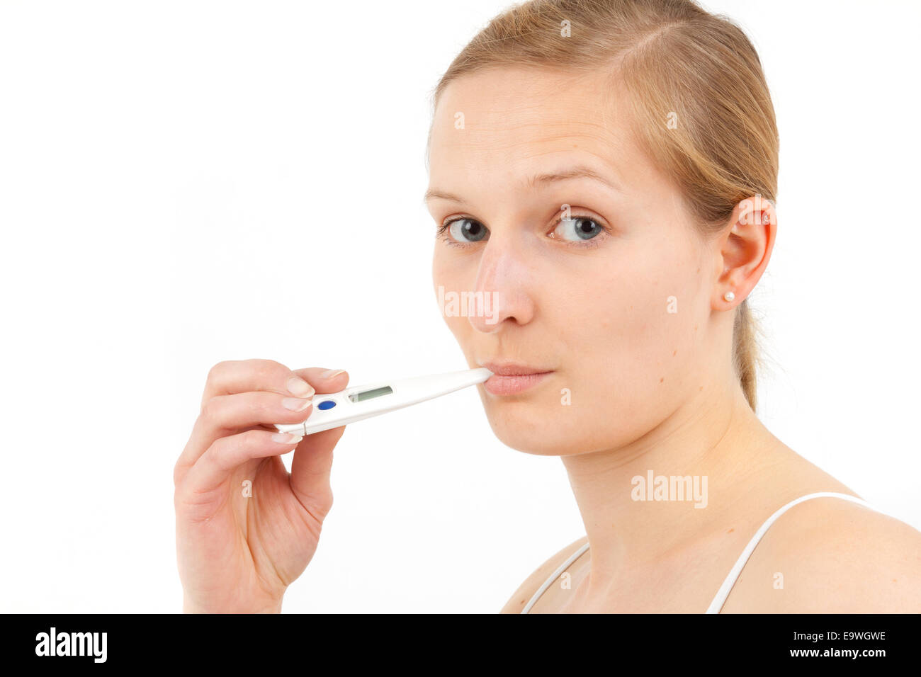 Young woman measuring temperature Stock Photo - Alamy