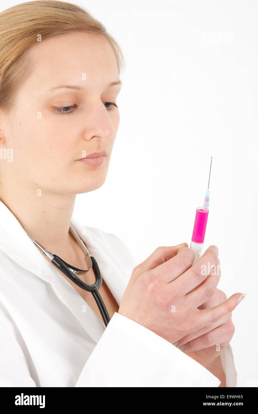 Young female doctor or nurse gives injection Stock Photo - Alamy
