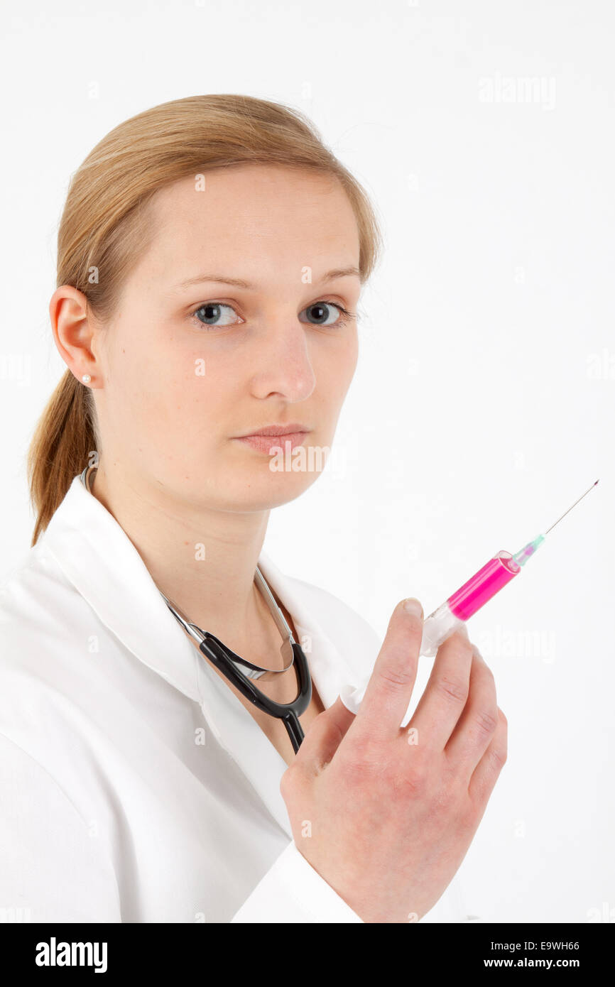Young female doctor or nurse gives injection Stock Photo - Alamy