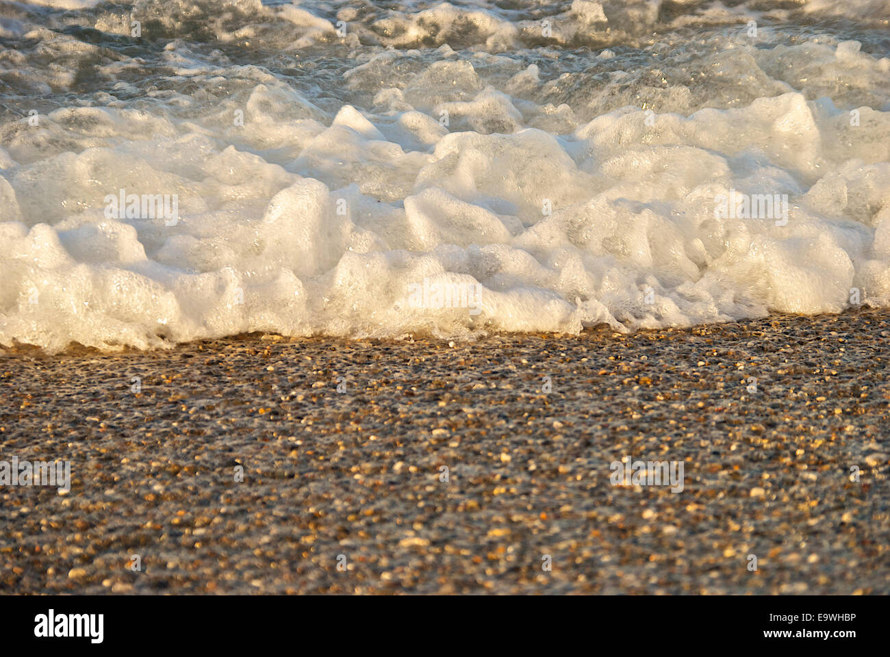 Small wave on the beach Stock Photo - Alamy