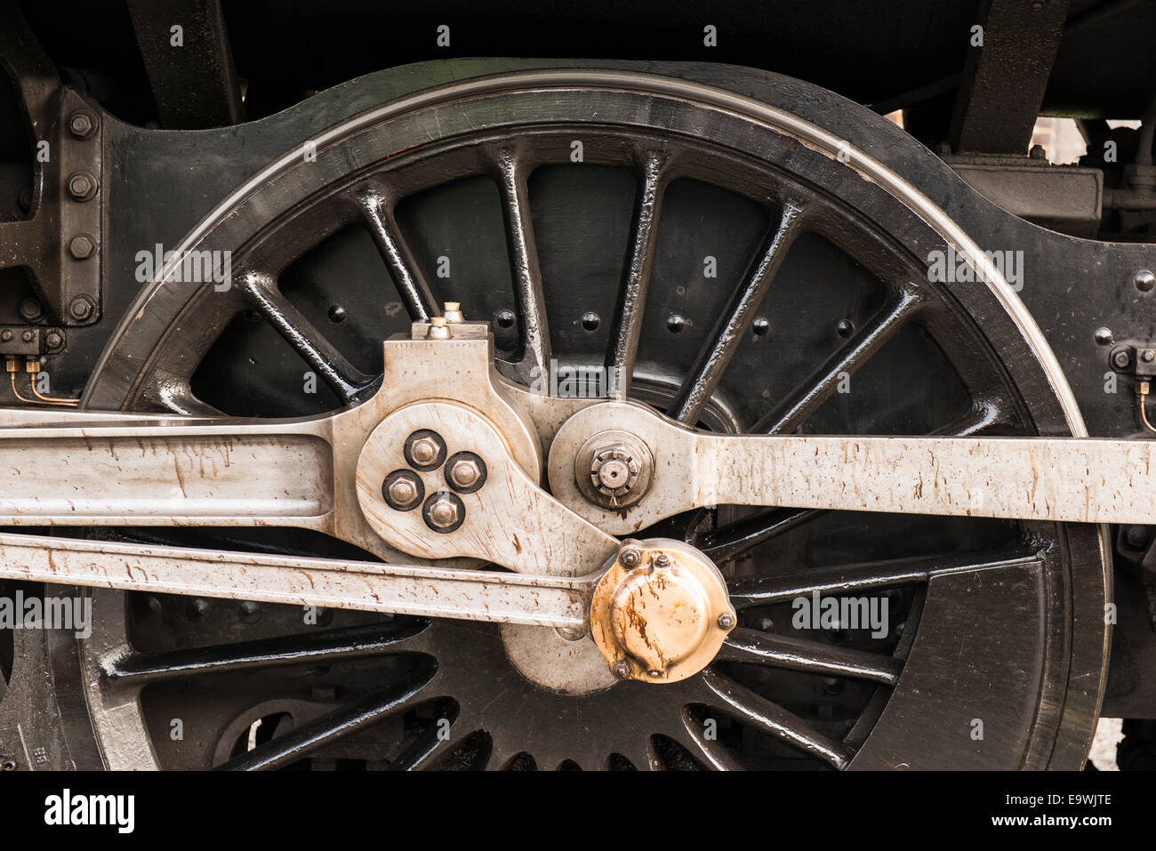 Close up drive wheel of the steam engine train, Oliver Cromwell. Steam ...
