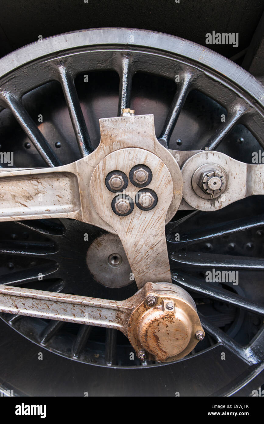 Close up drive wheel of the steam engine train, Oliver Cromwell. Steam ...