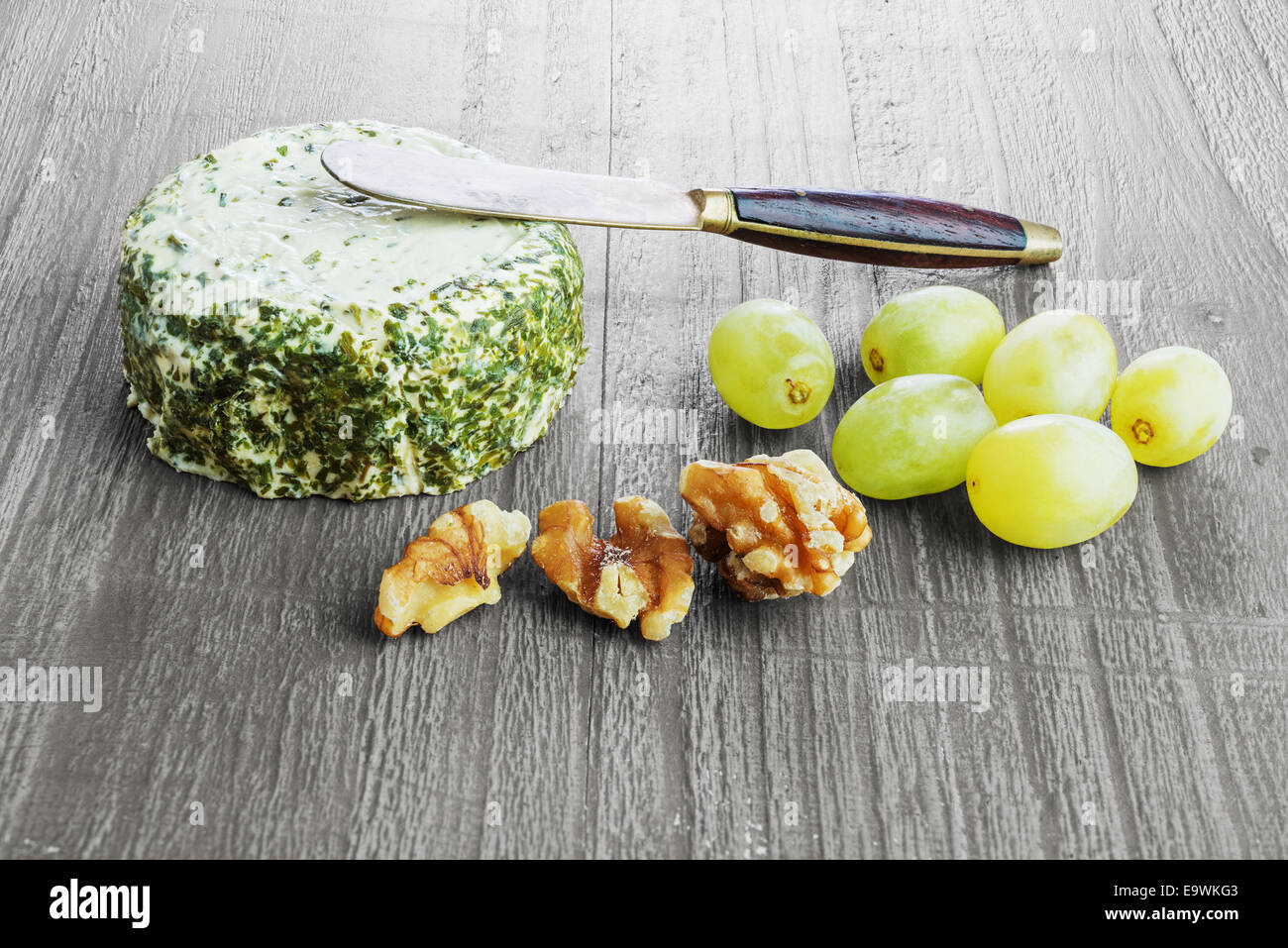 Soft cheese with spring onion and chives on retro wooden desk Stock ...