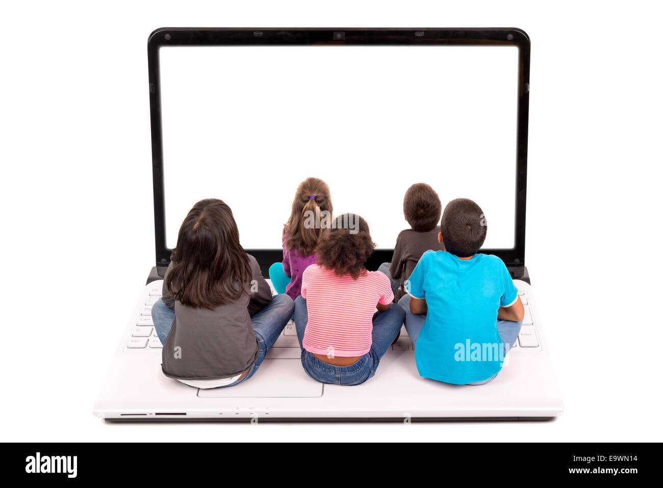 Group of young children in a laptop computer keyboard looking at the ...