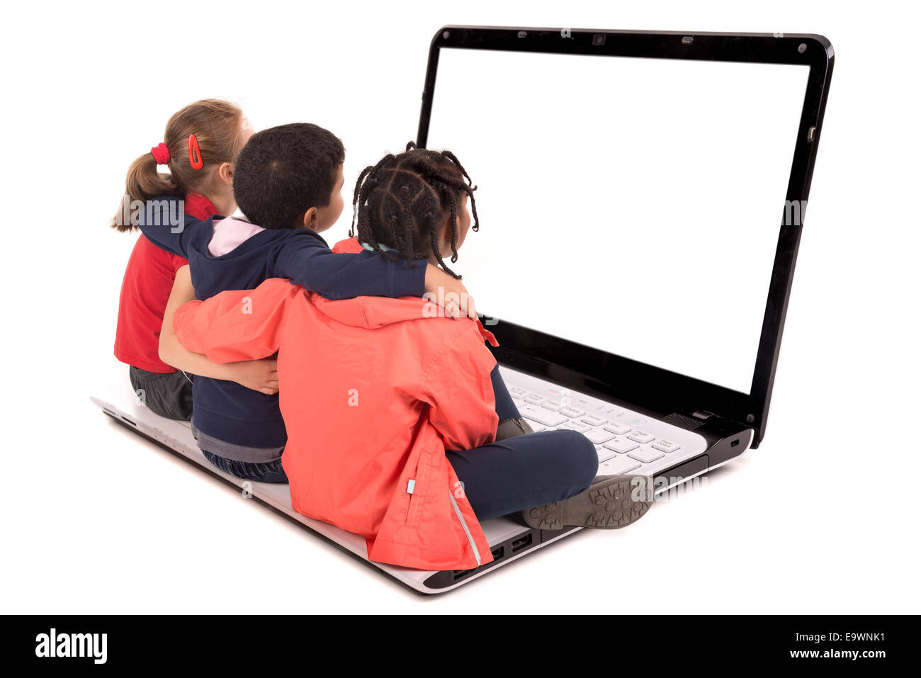 Group of young children in a laptop computer keyboard looking at the ...