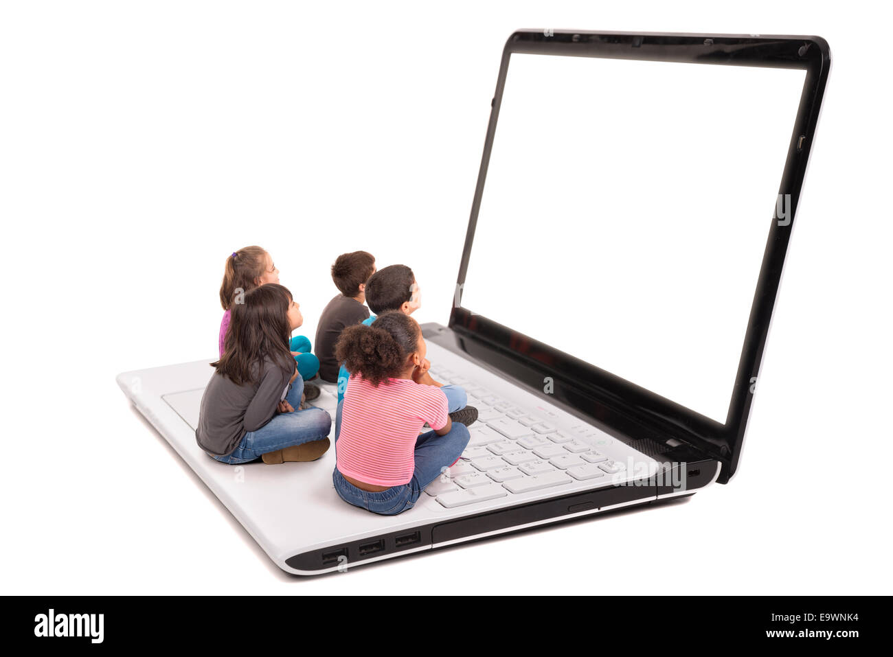 Group of young children in a laptop computer keyboard looking at the ...