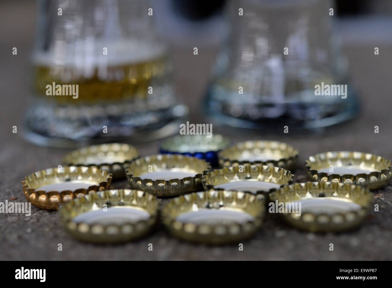 Crown caps and beer glasses, Germany, 17. October 2014. Photo: Frank ...