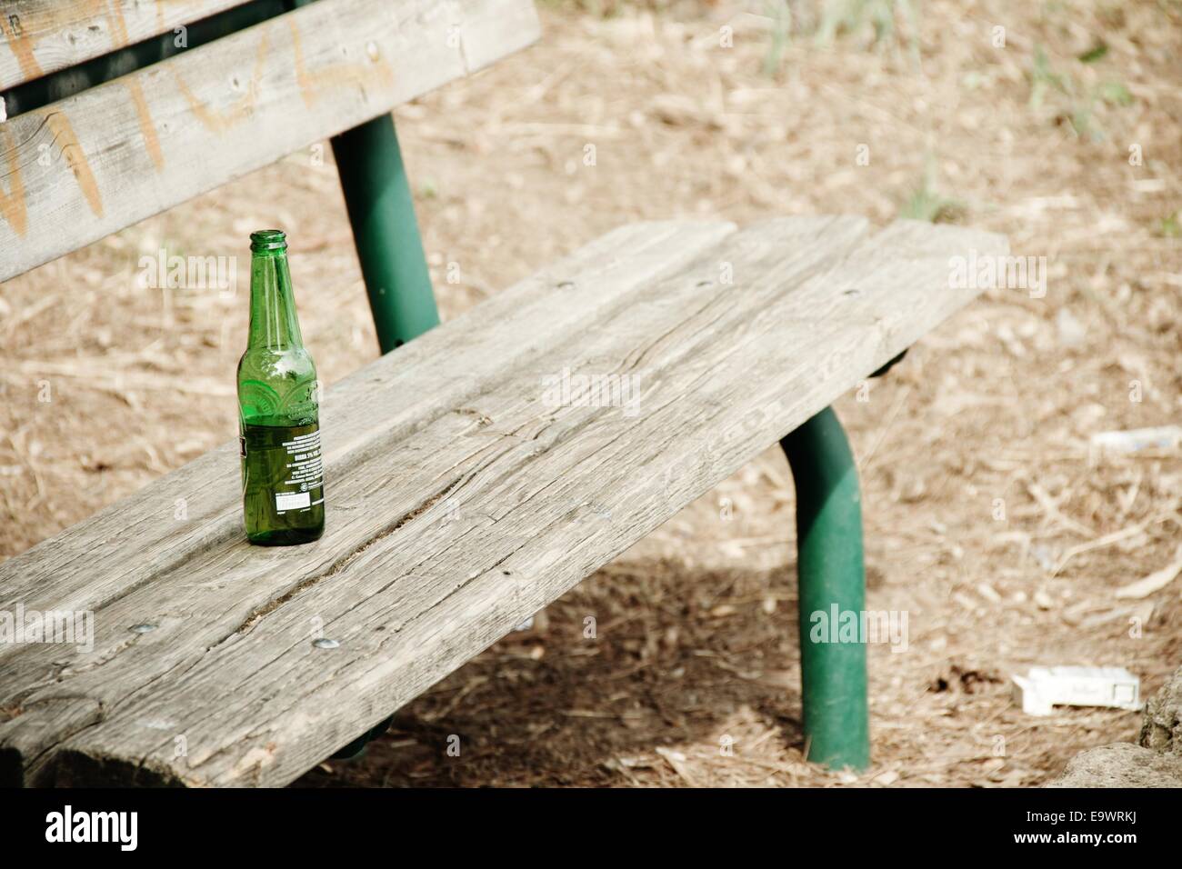 Glass Bottle on the ground Stock Photo - Alamy