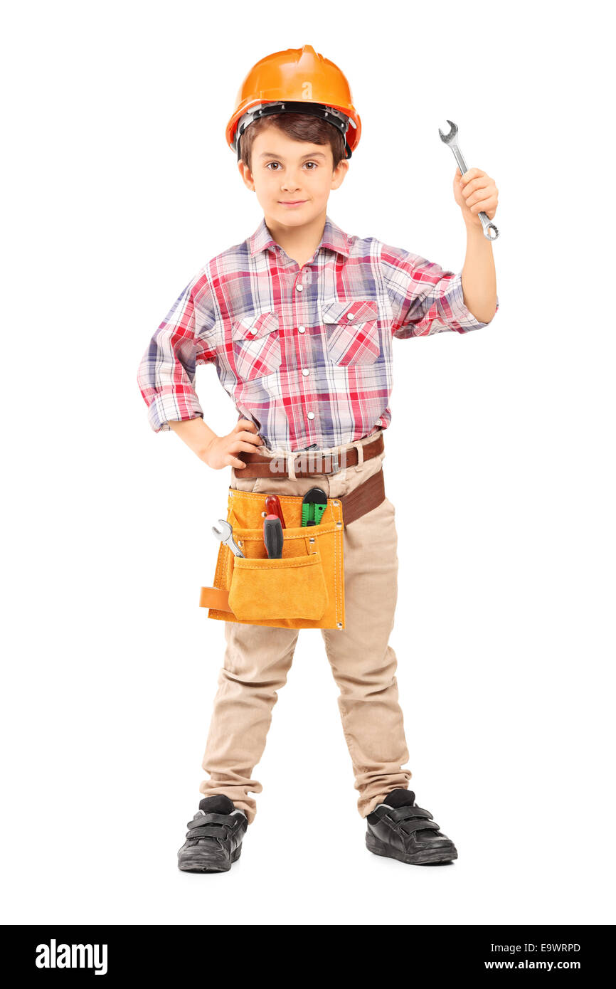 Full length portrait of a cute little boy wearing working clothes and ...