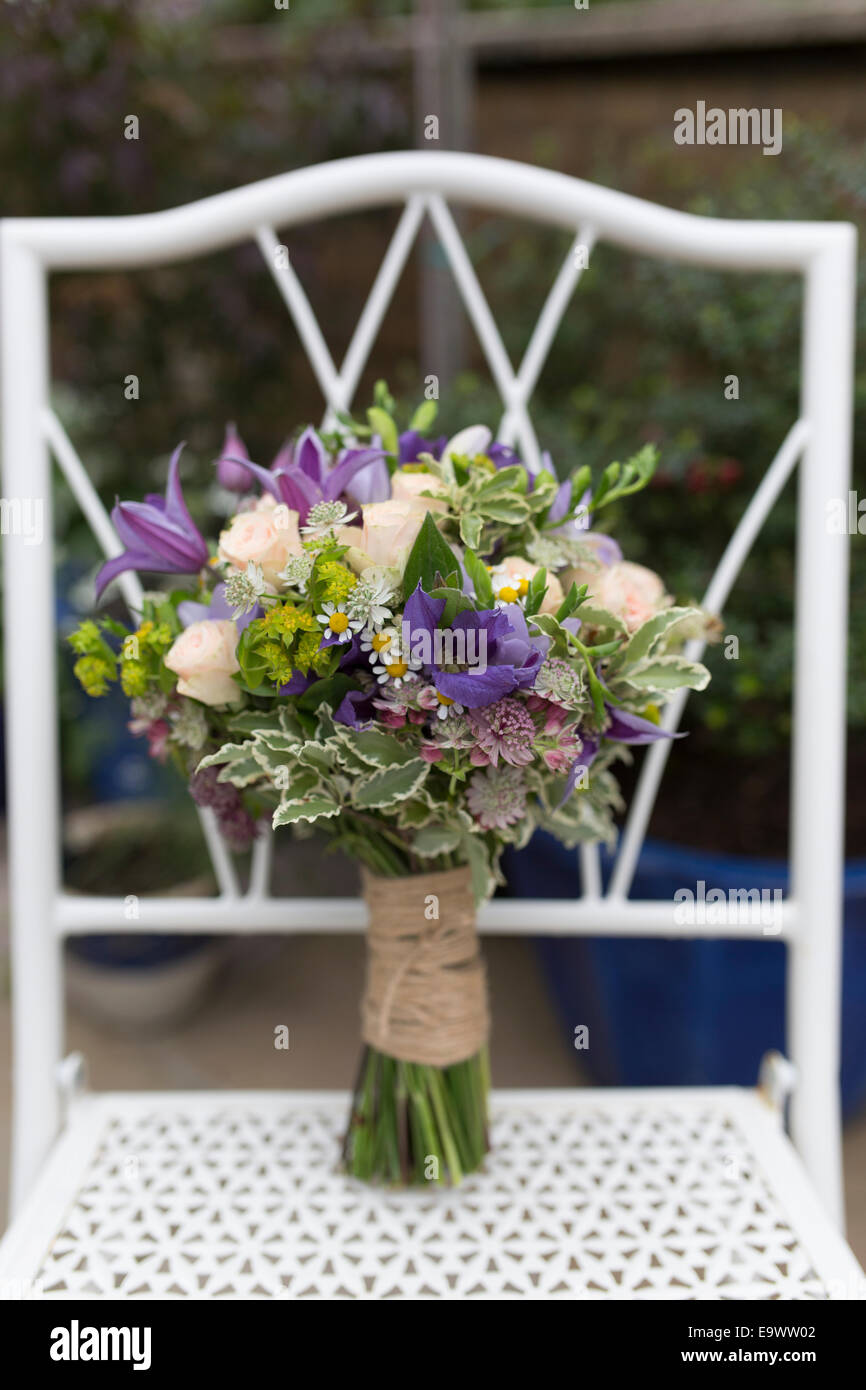 Wedding bouquet of flowers on a chair Stock Photo - Alamy