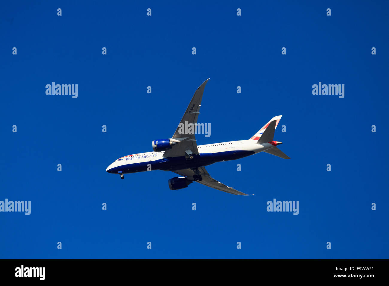 British Airways Boeing 787-8 Dreamliner from underneath against blue ...