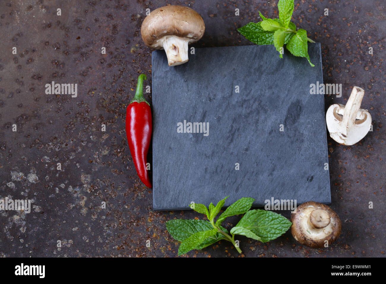 Food background on slate with herbs and vegetables Stock Photo - Alamy