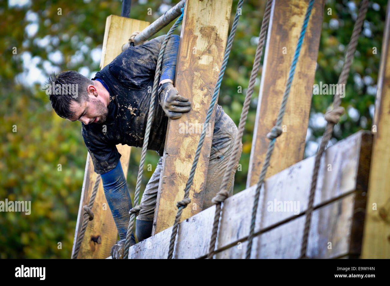 Participants battle against obstacles and mud in the 2014 Nuclear Races ...