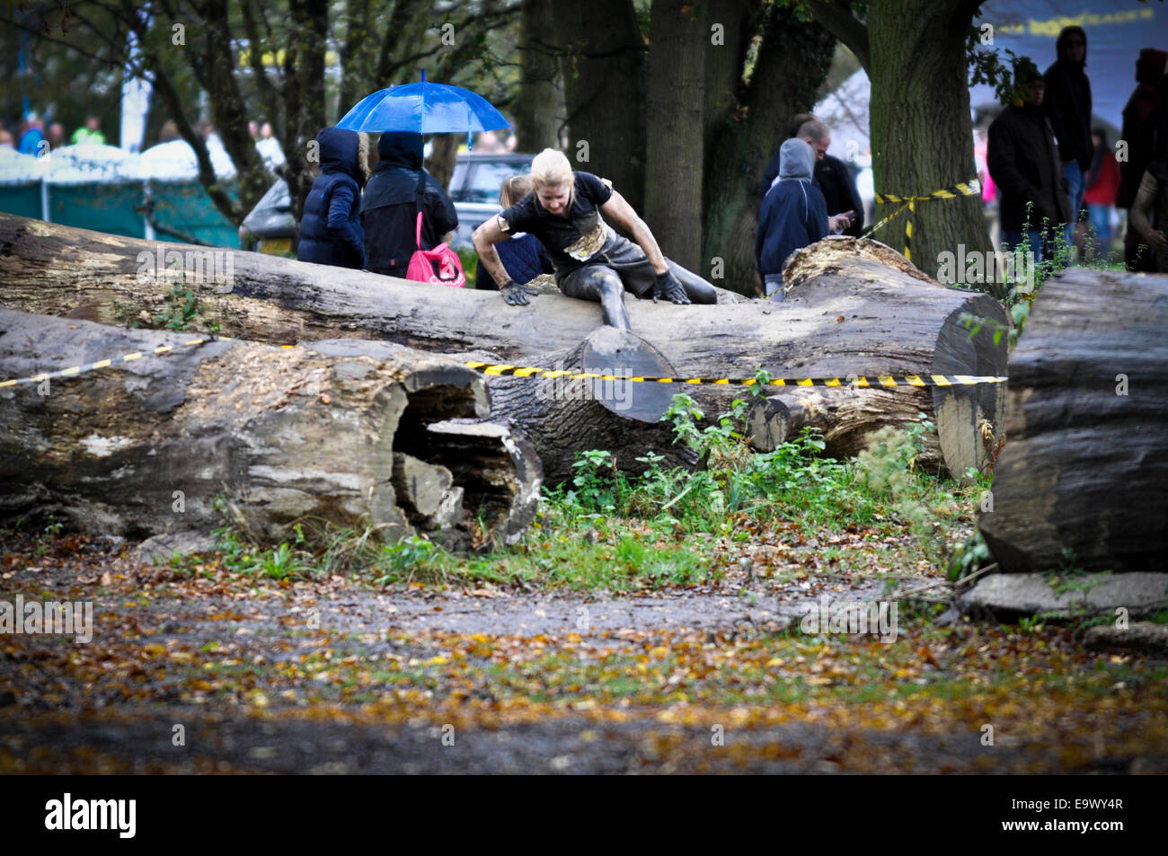 Participants battle against obstacles and mud in the 2014 Nuclear Races ...