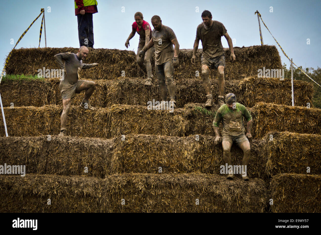 Participants battle against obstacles and mud in the 2014 Nuclear Races ...