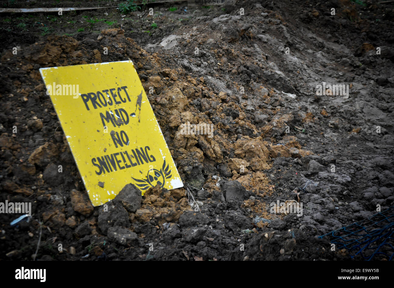 Participants battle against obstacles and mud in the 2014 Nuclear Races ...