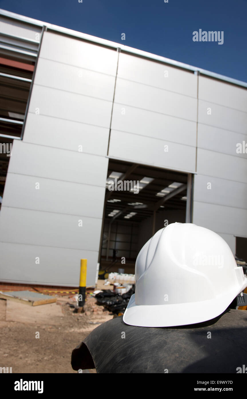 Hard Hat in front of Construction Stock Photo - Alamy