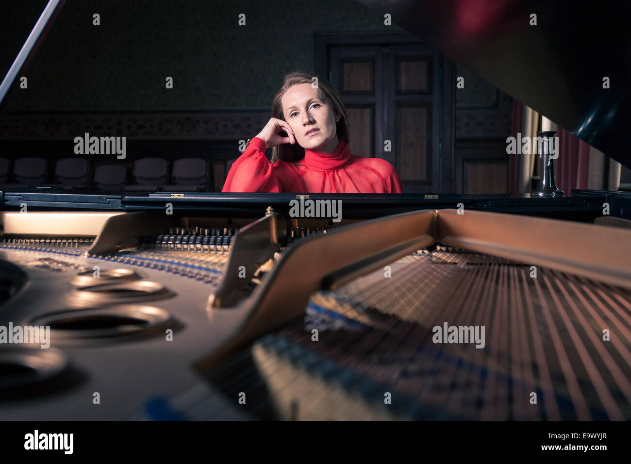 indoor portrait of a young female piano player Stock Photo - Alamy