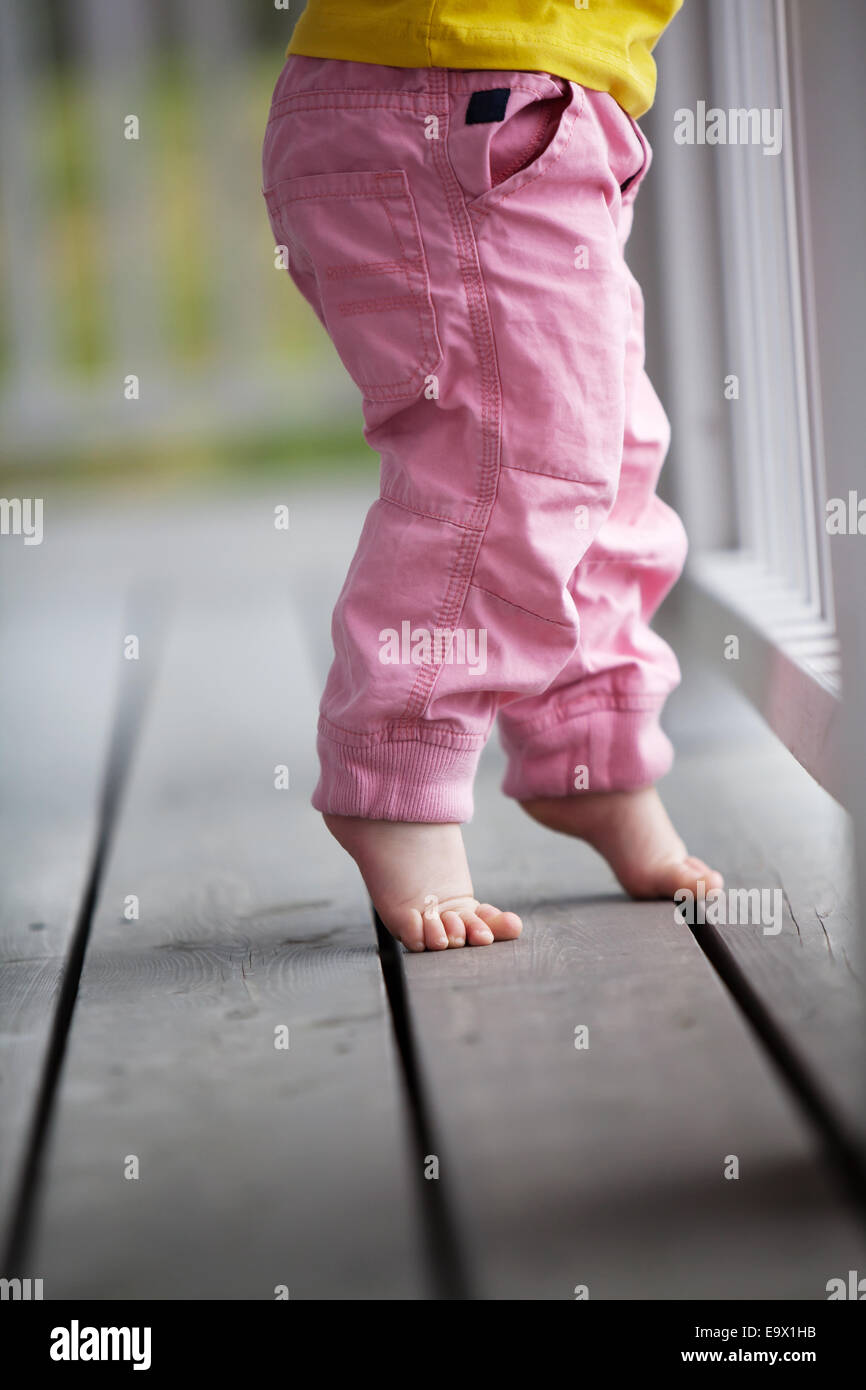 Little girl reaching up Stock Photo - Alamy