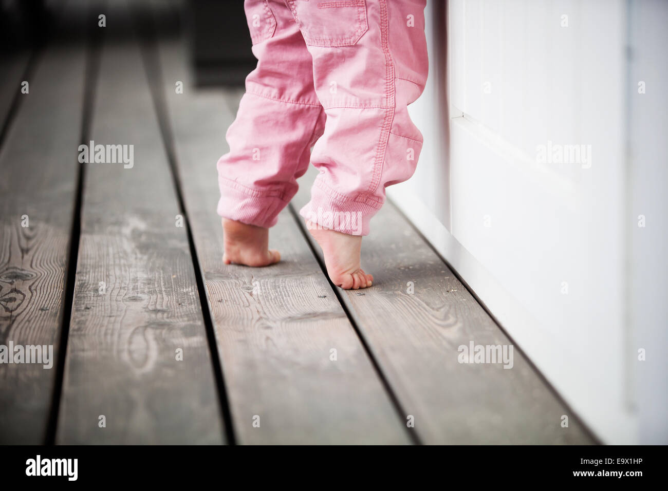 Little girl reaching up Stock Photo - Alamy