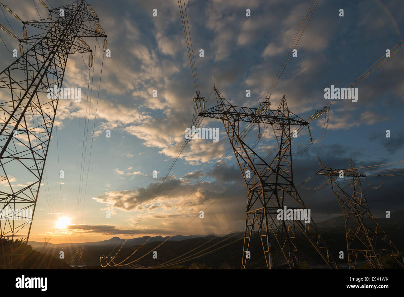 Power Pylons on sunset sky Stock Photo - Alamy