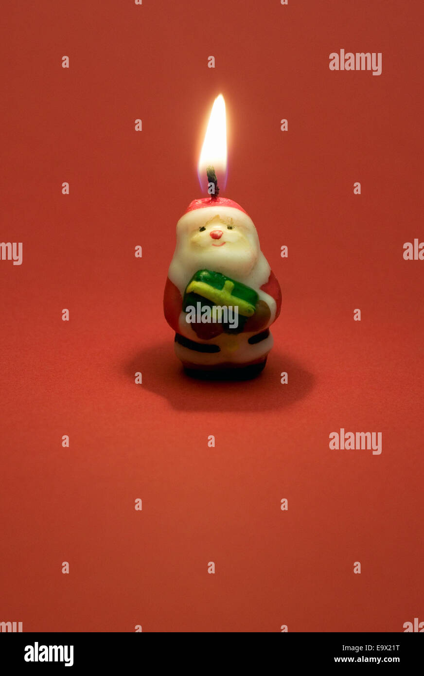burning santa claus candle Stock Photo - Alamy