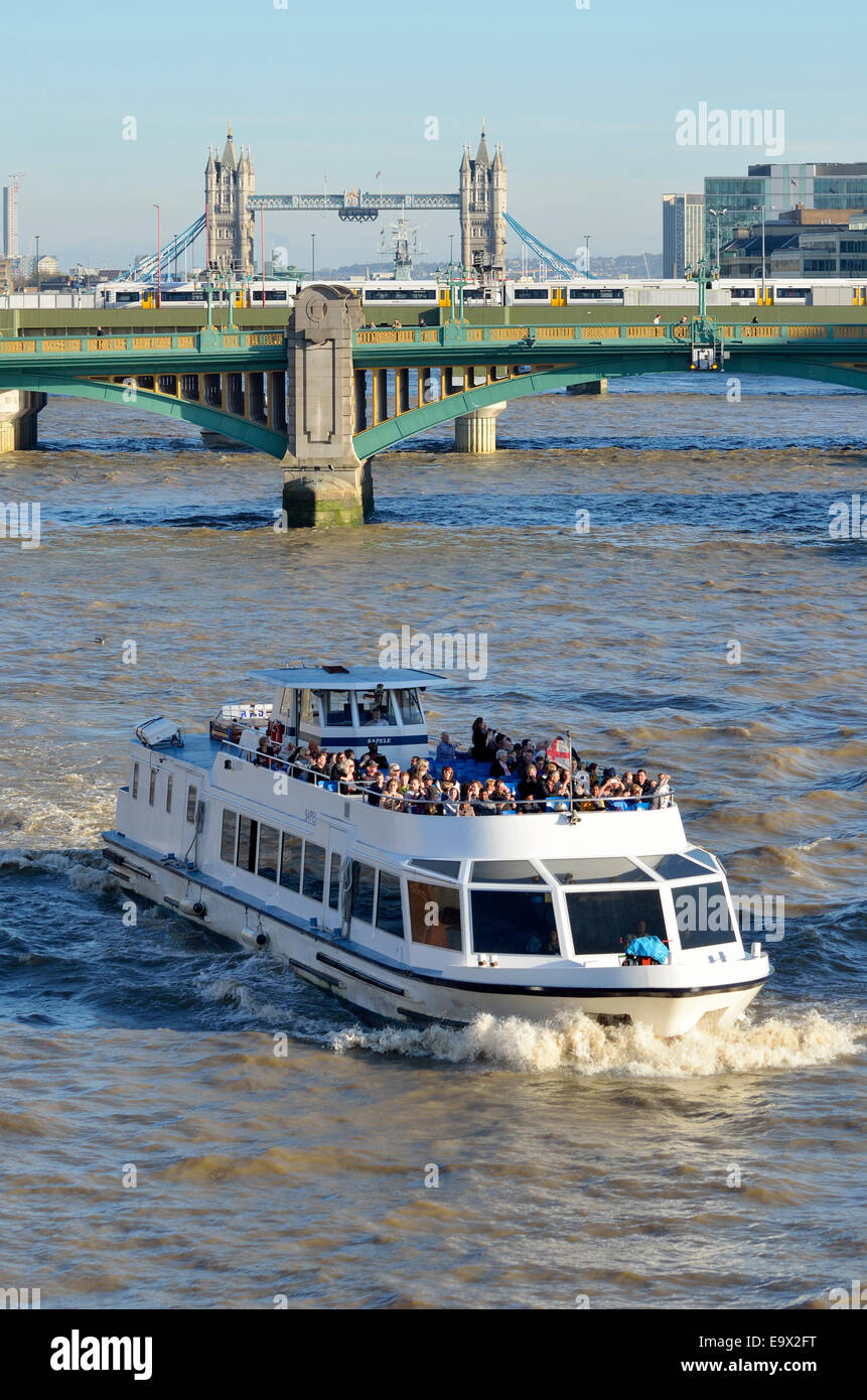 London, England, UK. Riverboat M.V. Sapele passing under London Bridge ...