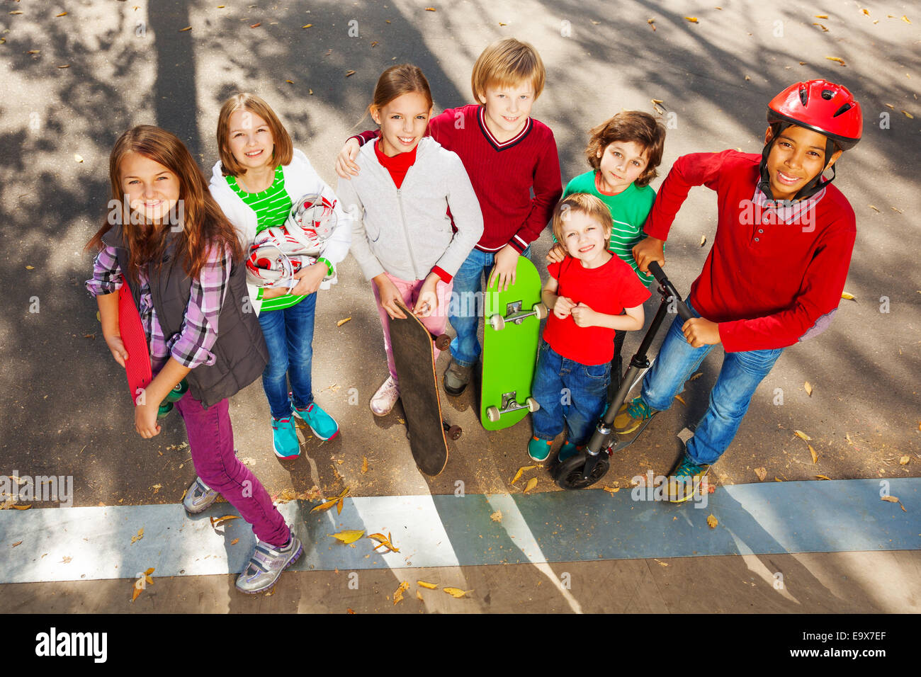 International friends stand with skateboards Stock Photo - Alamy