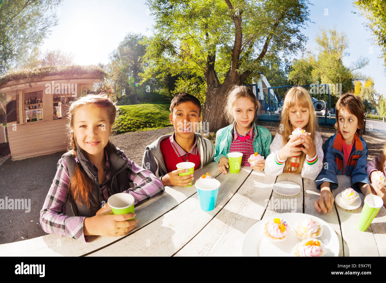 Happy group of international children drinking tea Stock Photo - Alamy