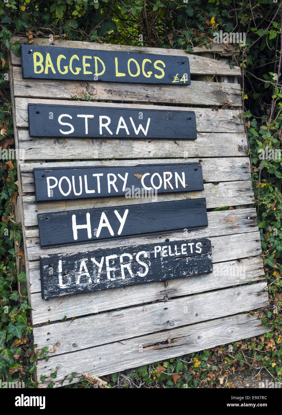 Roadside pallet farm sign for bagged logs, straw, poultry corn, hay and ...