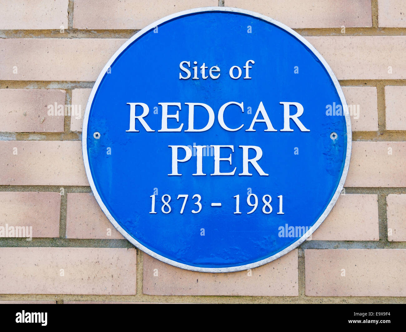 Blue plaque on Redcar Seafront showing the location of the Redcar Pier ...