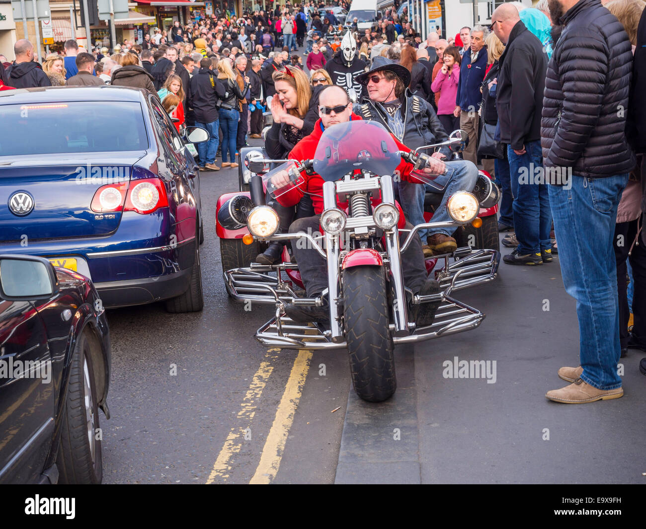 Dense crowds at Whitby Goth Weekend a custom motor trike takes to the ...