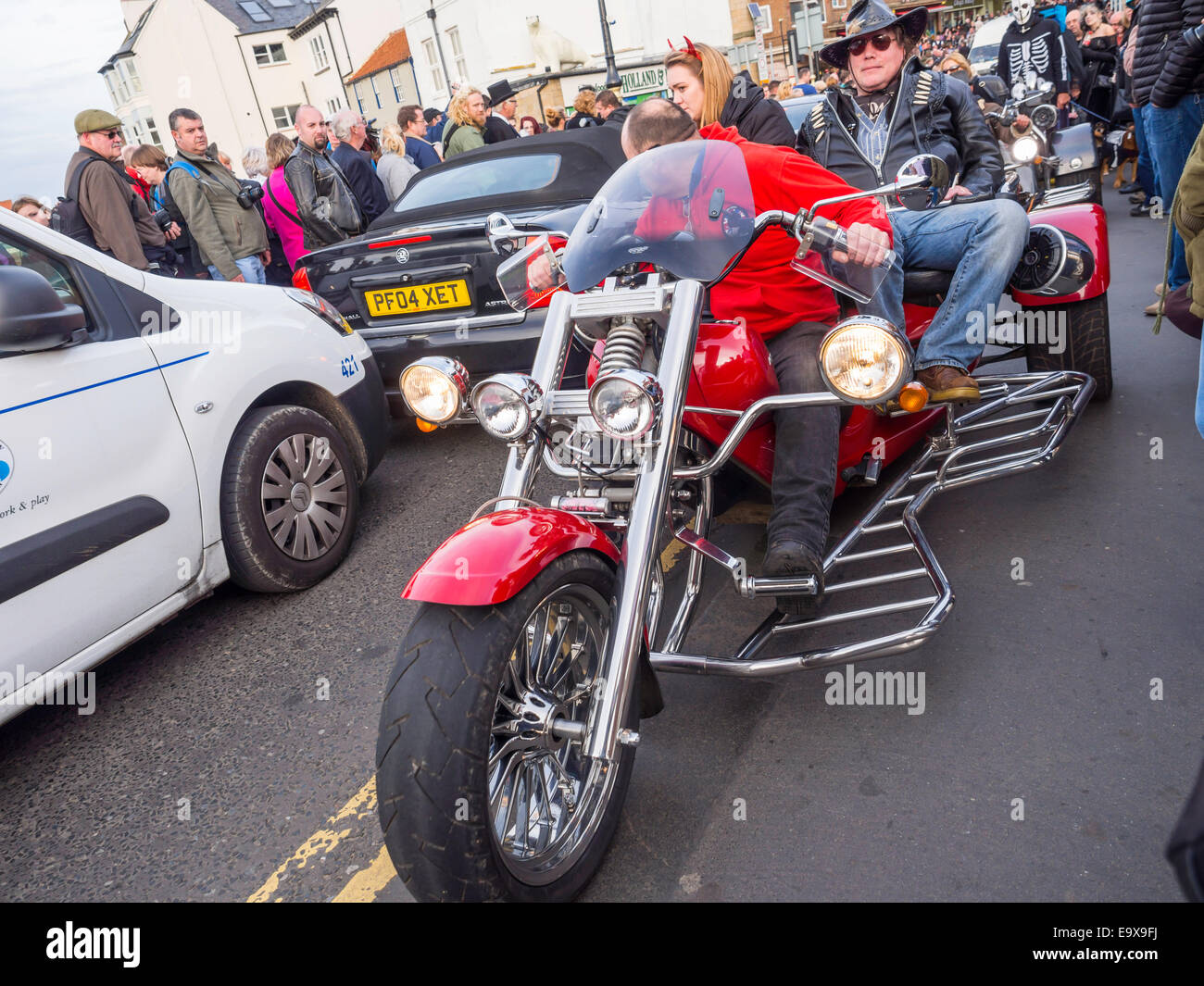 Dense crowds at Whitby Goth Weekend a custom motor trike takes to the ...