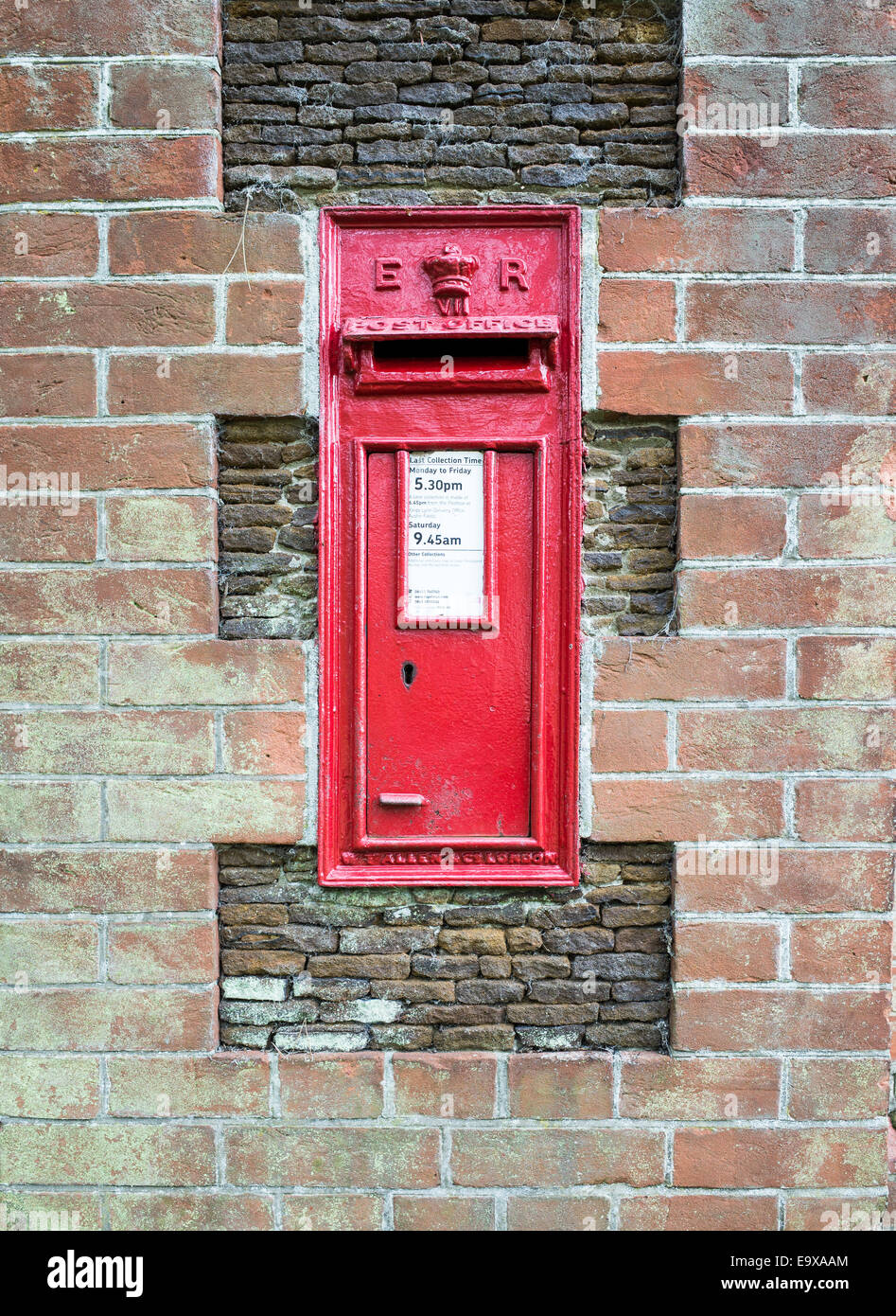 Red post box put into the wall around Sandringham House during the ...